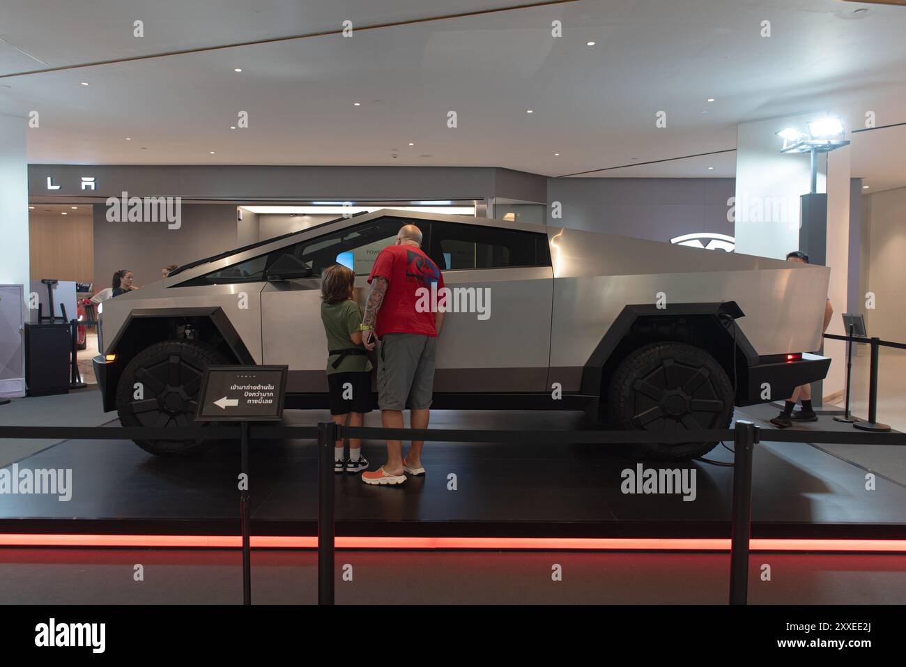 People view a Tesla Cybertruck the electric pick-up is displayed at ...
