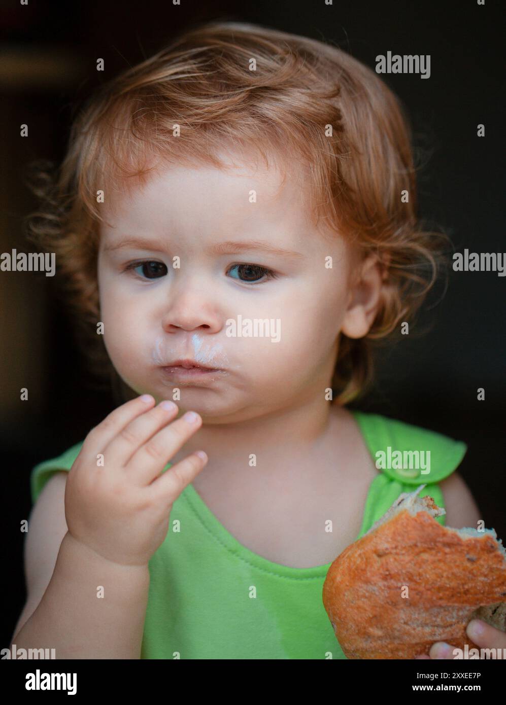 Cute toddler child eating sandwich, self feeding concept Stock Photo ...
