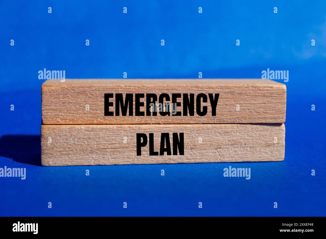 Emergency plan message written on wooden blocks with blue background ...