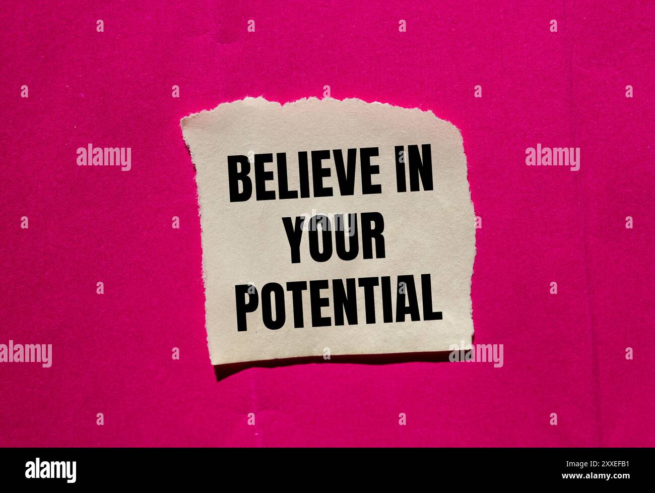 Believe in your potential message written on ripped torn paper piece on ...