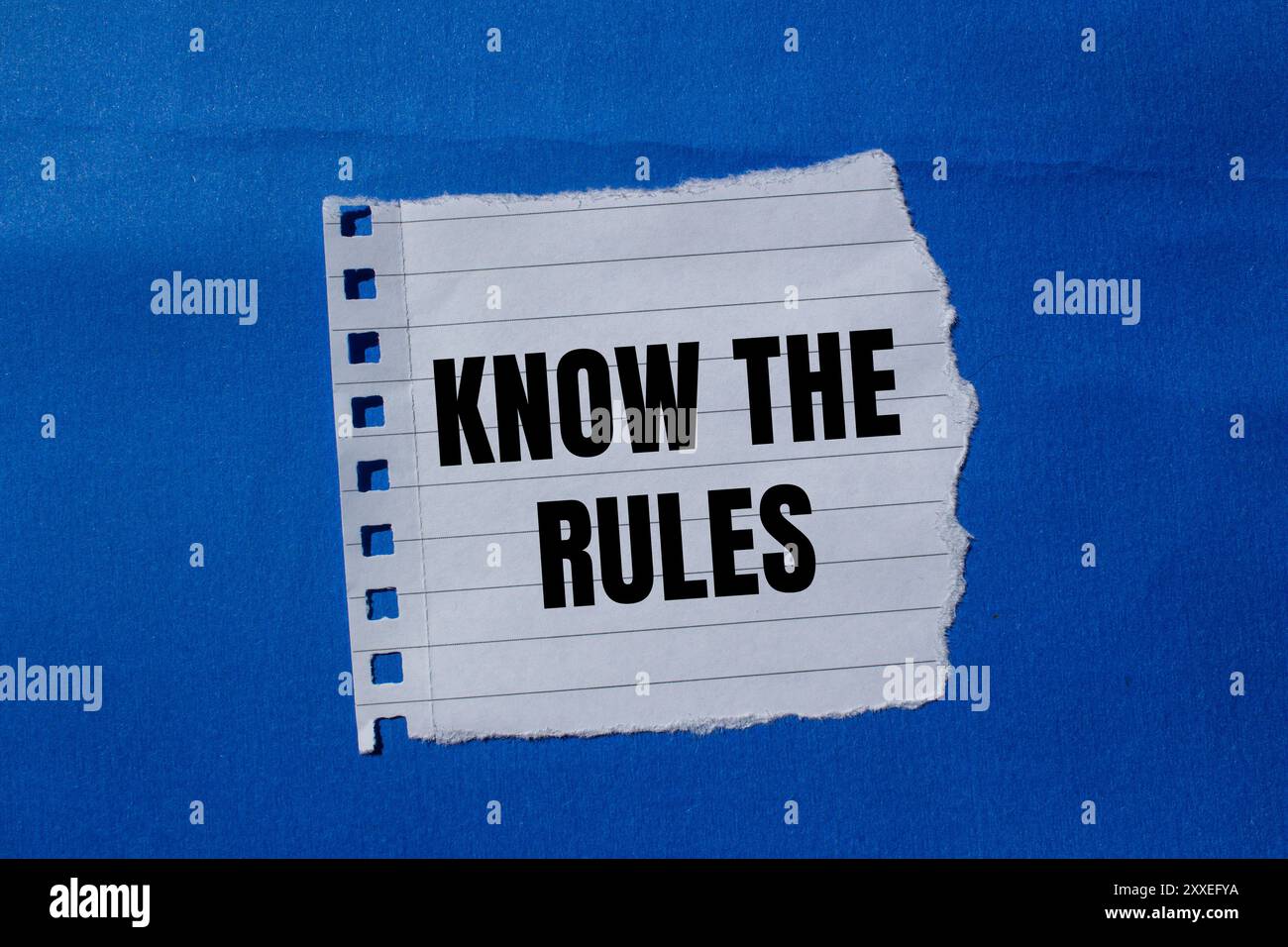 Know the rules message written on ripped torn paper piece with blue ...
