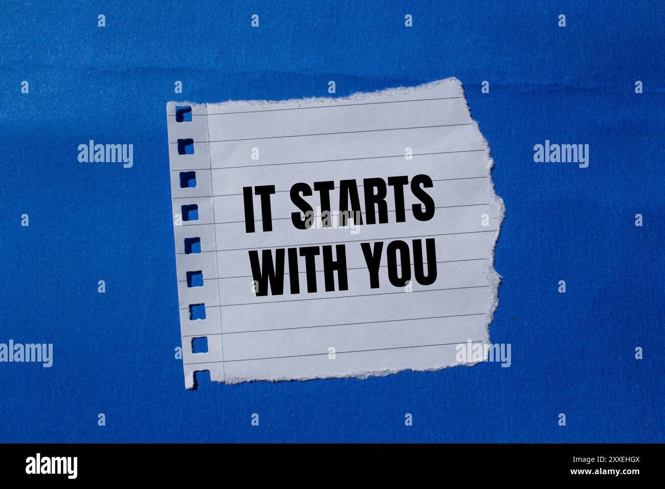 It starts with you message written on ripped torn paper piece with blue ...