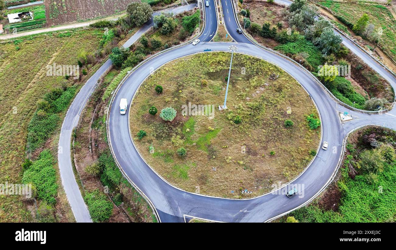 Aerial view of cars driving in a circle in city traffic. High quality ...