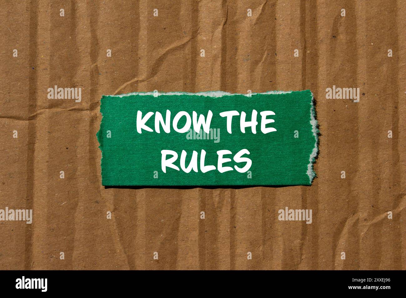 Know the rules message written on ripped torn green paper piece with ...