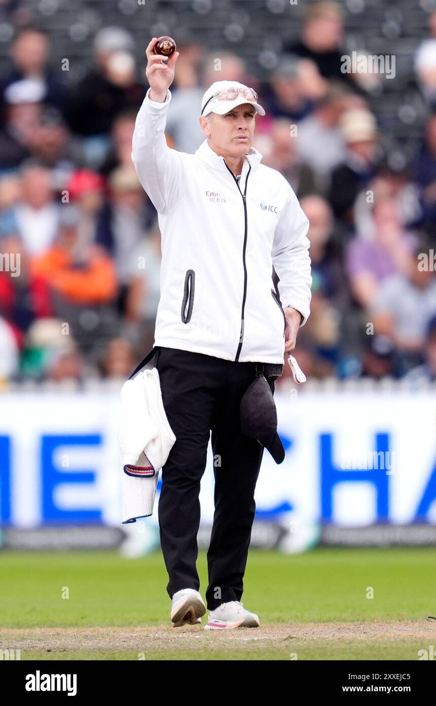 Umpire Chris Gaffaney signals for the new balls during day four of the ...