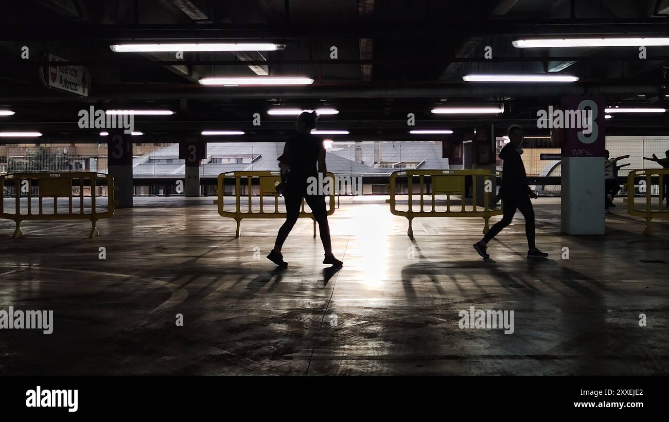 people walk through the closed parking Stock Photo - Alamy