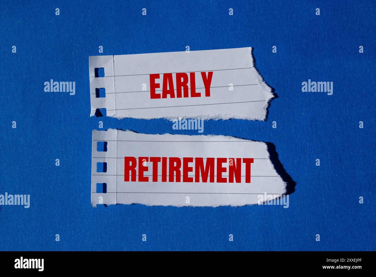 Early retirement message written on ripped torn paper pieces with blue ...