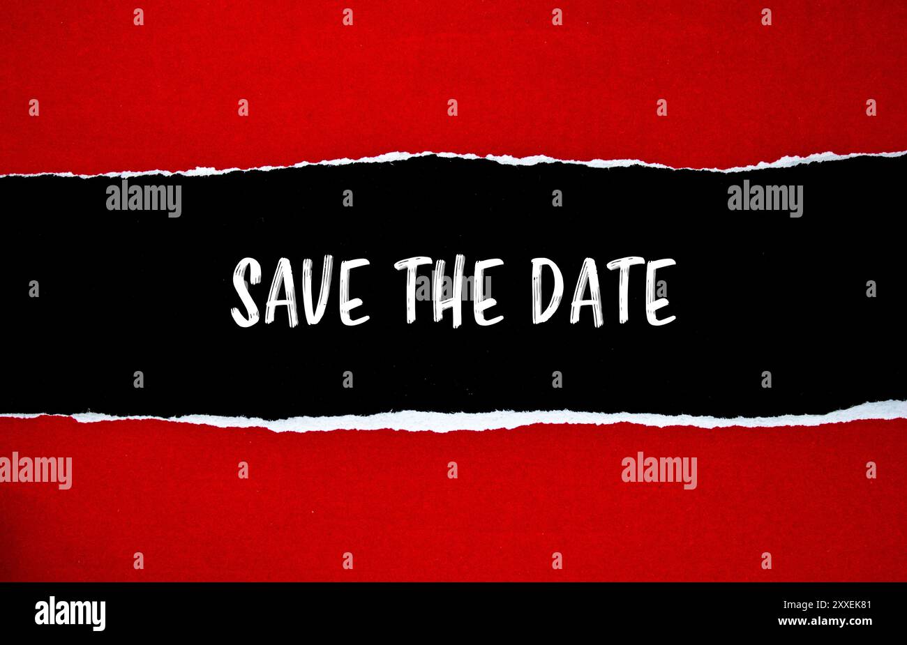 Save the date message written on ripped torn red paper with black background. Conceptual save ...