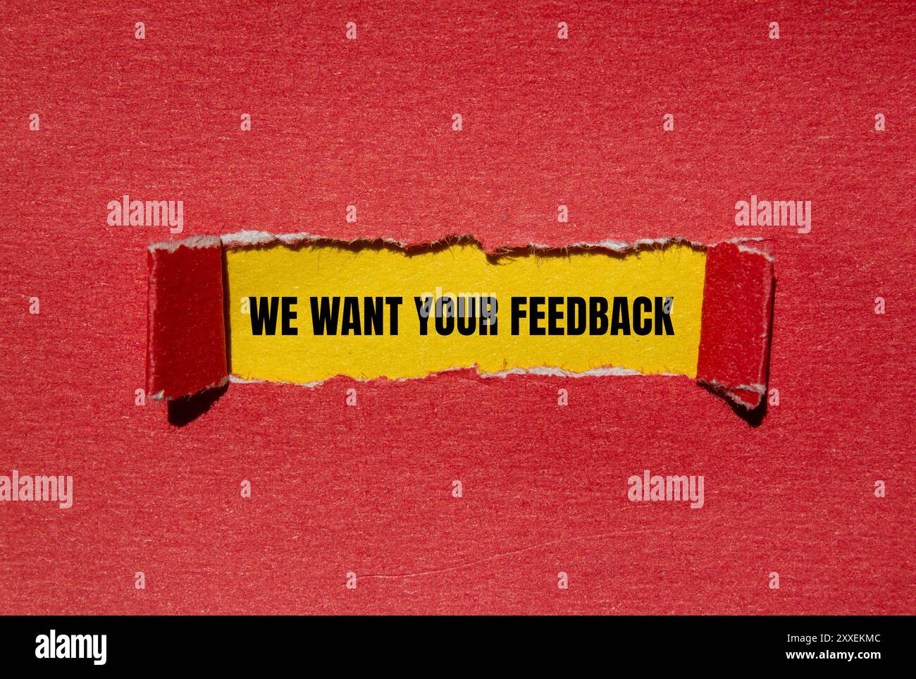 We want your feedback message written on ripped torn red paper with yellow background ...