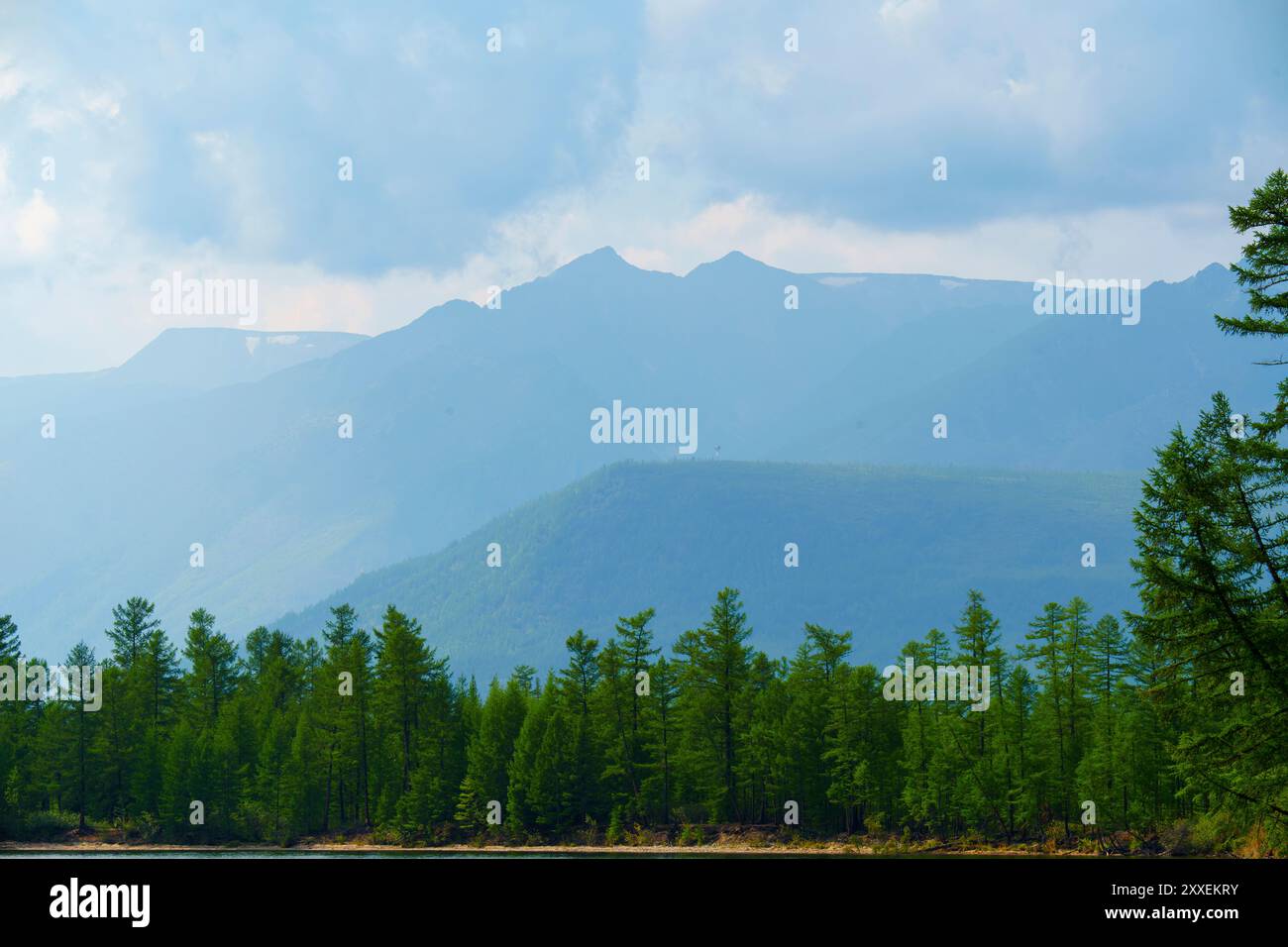 Mountain range rises behind lush hi-res stock photography and images ...