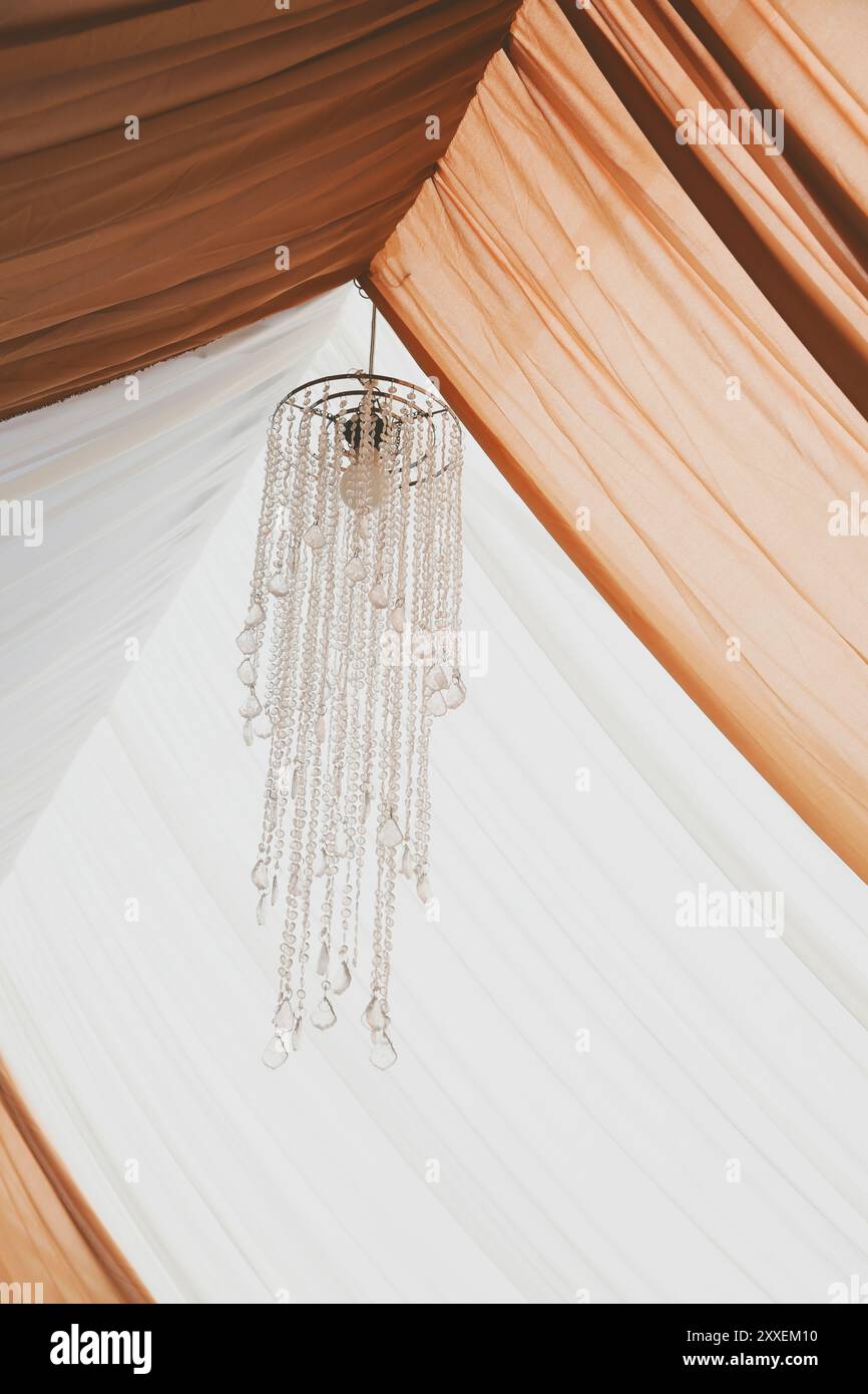 A view of a the ceiling of an event tent curtain, featuring a sparkling ...