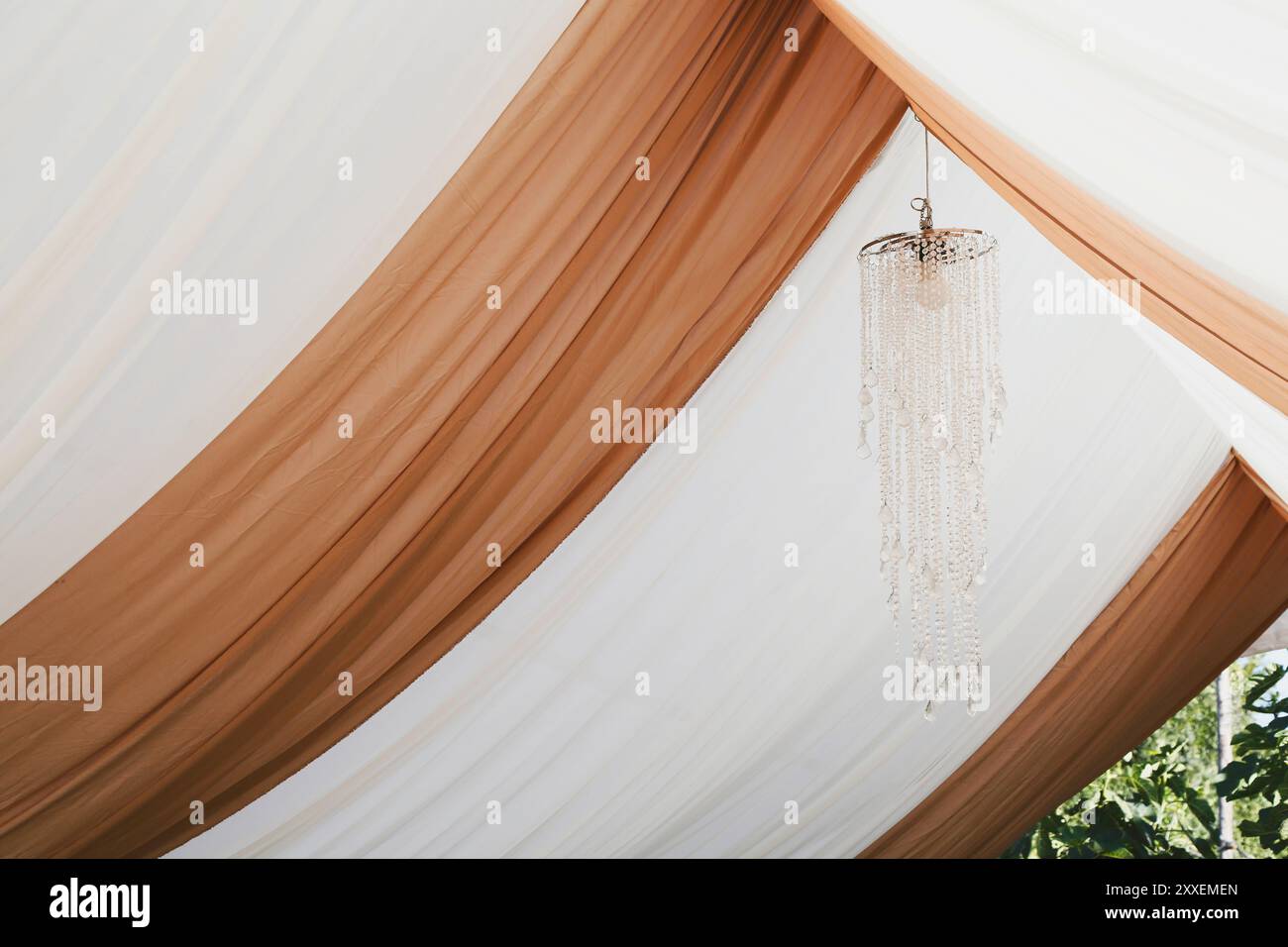 A view of a the ceiling of an event tent curtain, featuring a sparkling ...