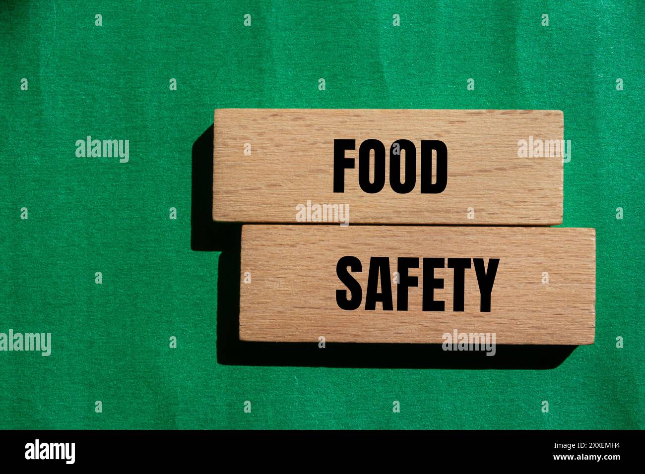 Food safety message written on wooden blocks with green background ...