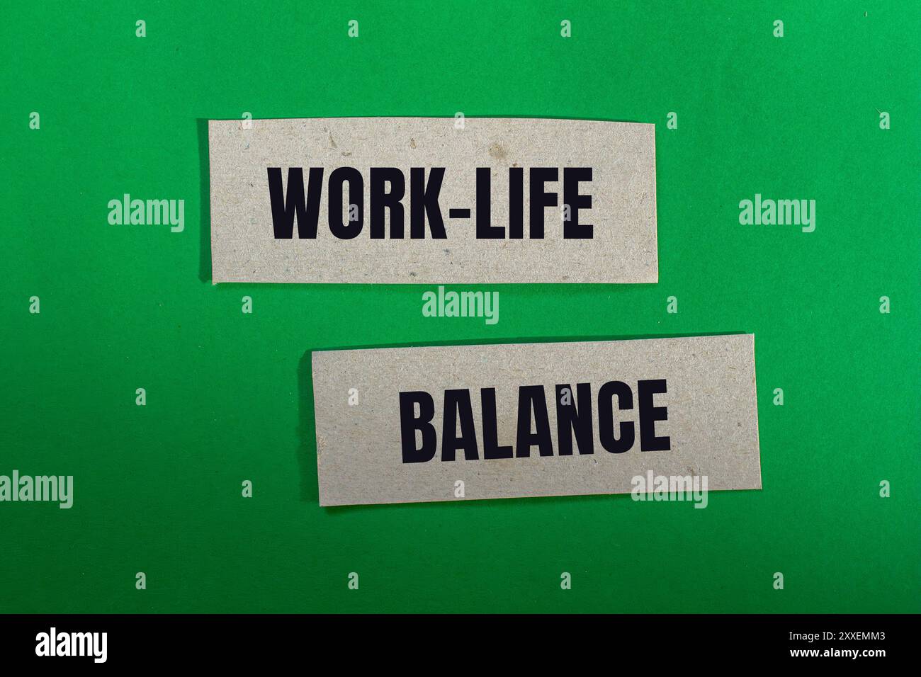 Work life balance message written on paper pieces with green background ...