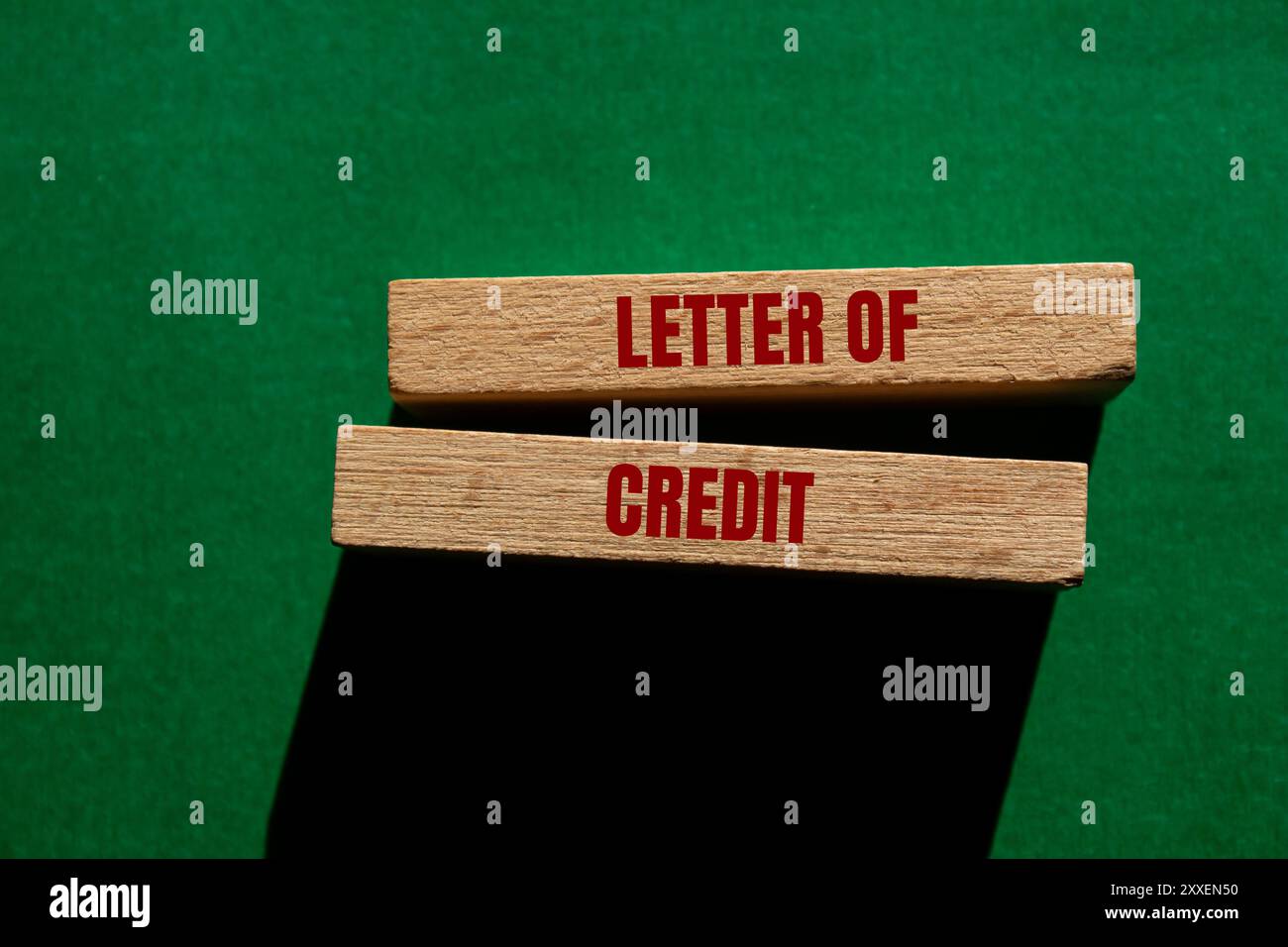Letter of credit message written on wooden blocks on green background ...