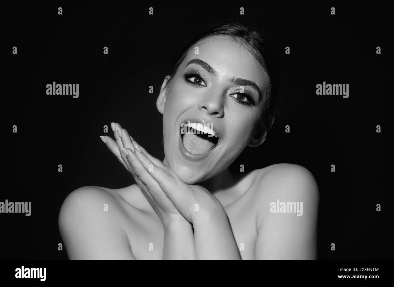 Shocked face of woman shouting WOW, isolated on studio background with ...