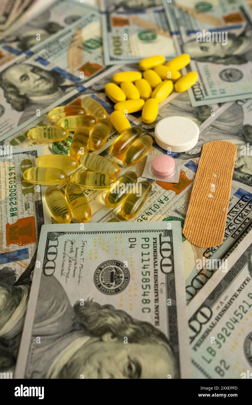 Stethoscope,vitamin pills,medicines and US dollars on white background ...