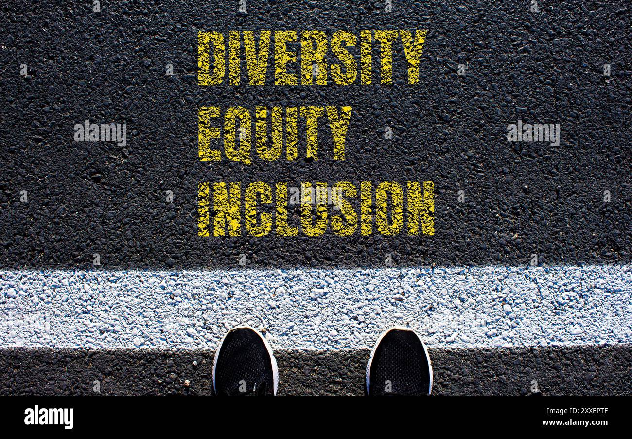 Diversity equity and inclusion message written on asphalt road ...