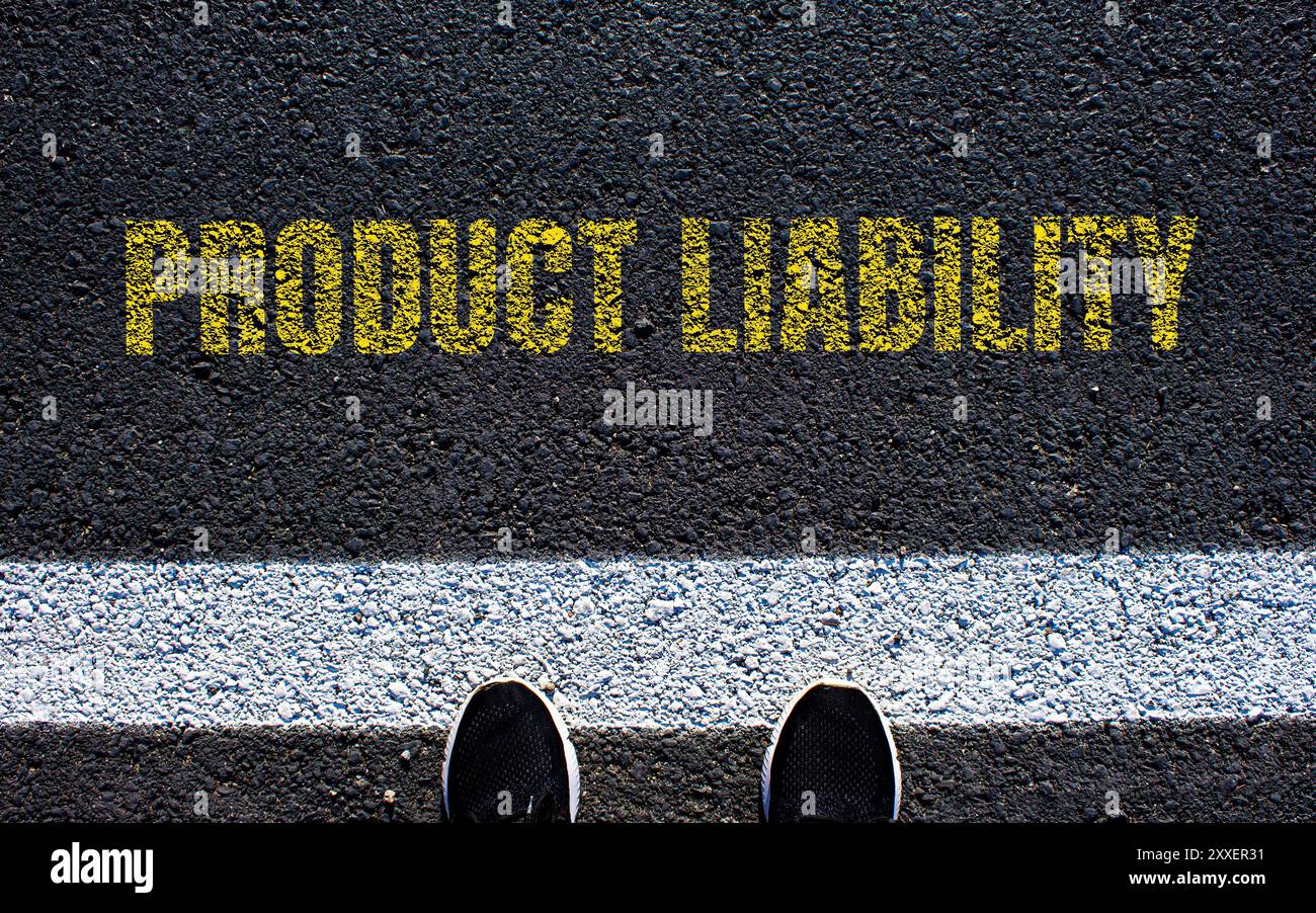 Product liability message written on asphalt road. Conceptual product ...