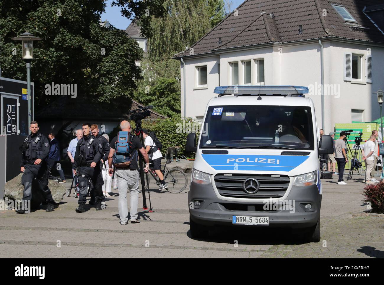 Solingen, Germany. 24th Aug, 2024. A police car parks near a site of a ...