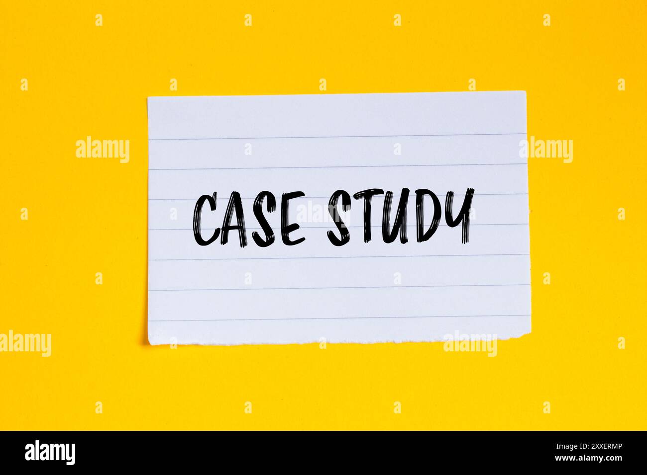 Case study message written on ripped white paper piece with yellow background. Conceptual case ...
