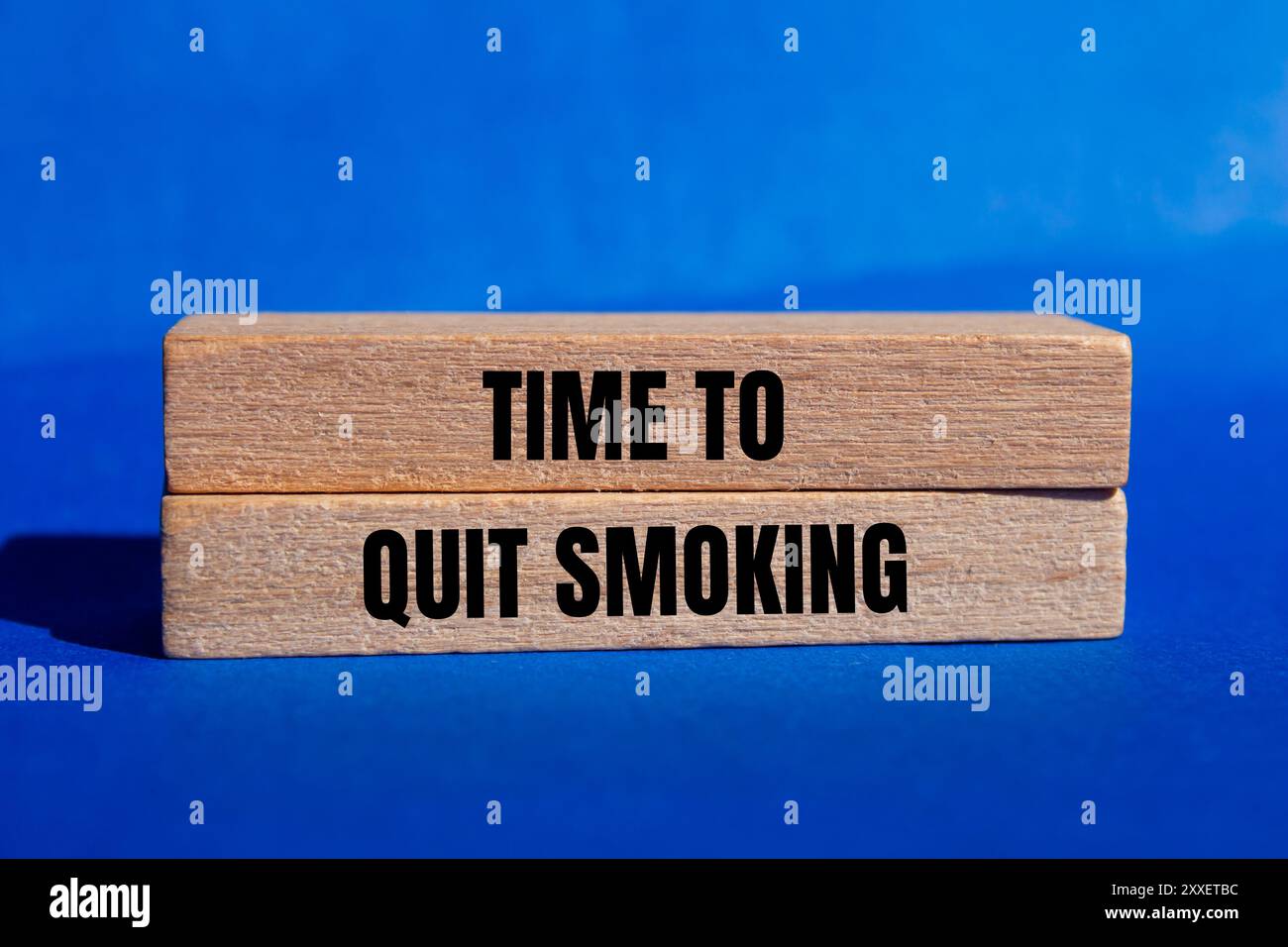 Time to quit smoking message written on wooden blocks with blue ...