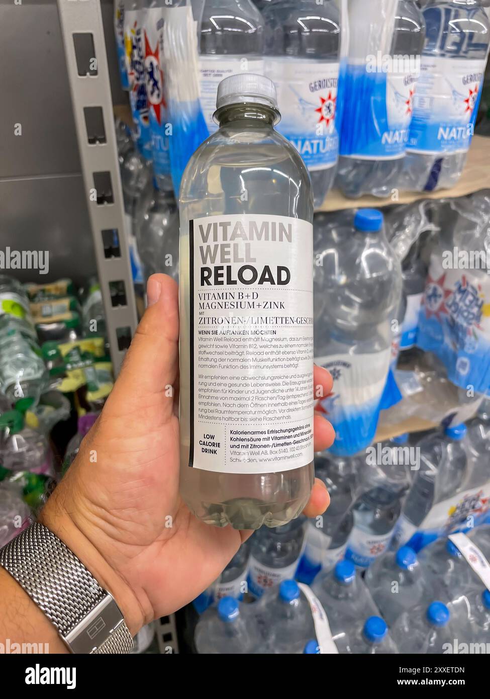 Germany Berlin August 17, 2024. A bottle of vitamin water is being held ...