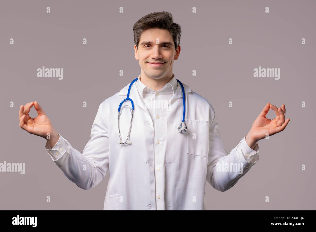 Calm physician man relaxing, meditating, refuses stress. Brunette ...