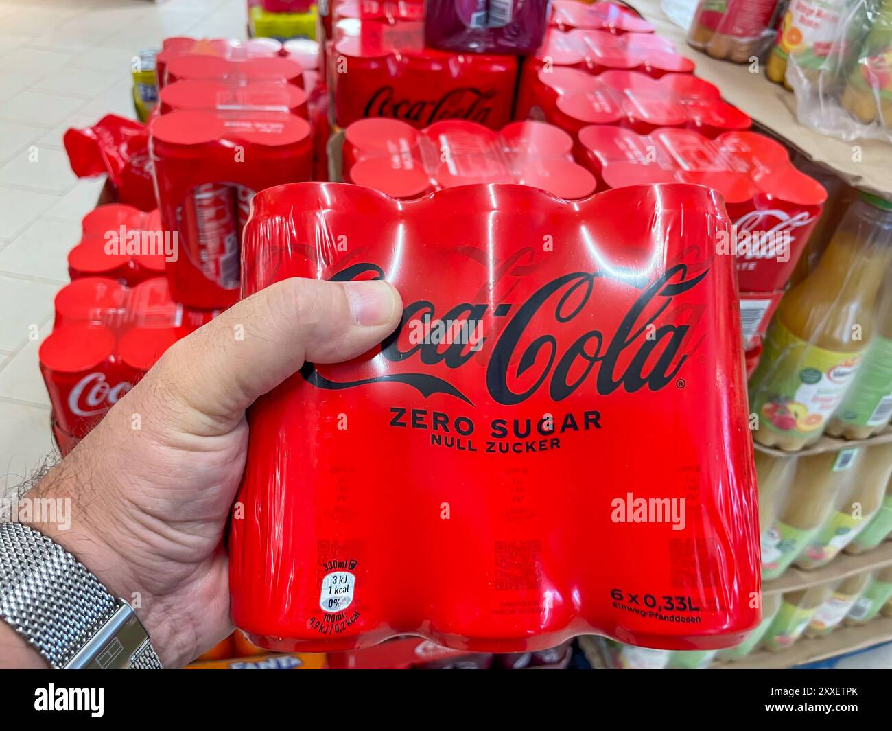 Germany Berlin August 23, 2024. A person is holding a can of Coca-Cola ...