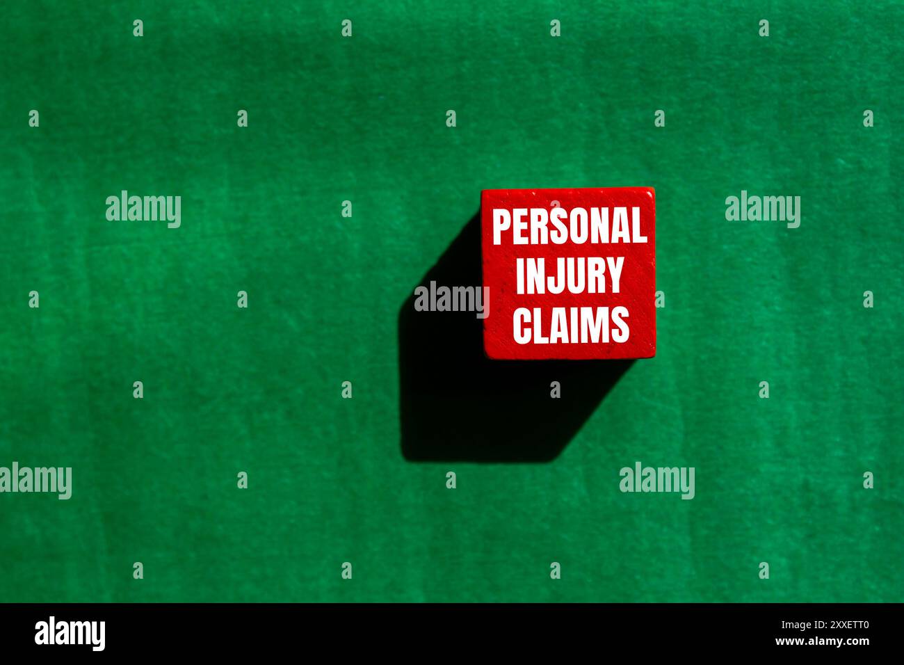 Personal injury claims message written on red wooden cube with green ...