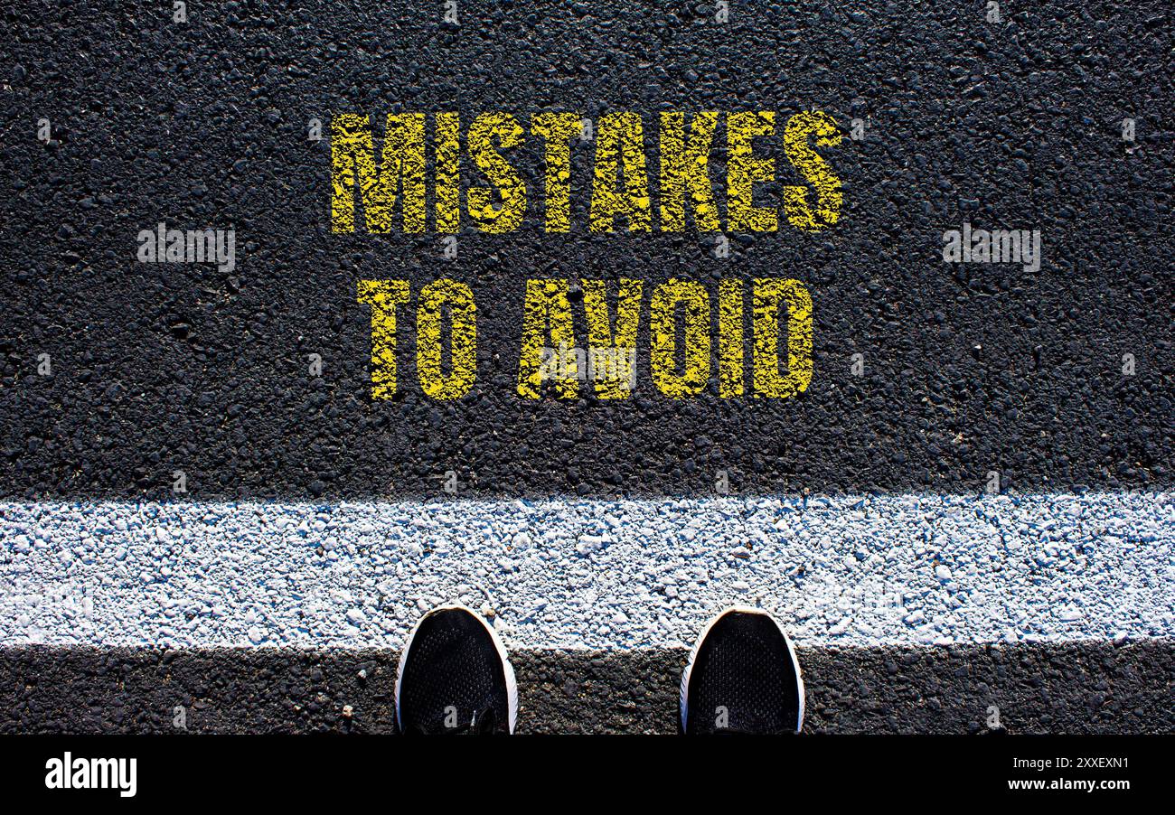 Mistakes to avoid message written on asphalt road. Conceptual mistakes ...
