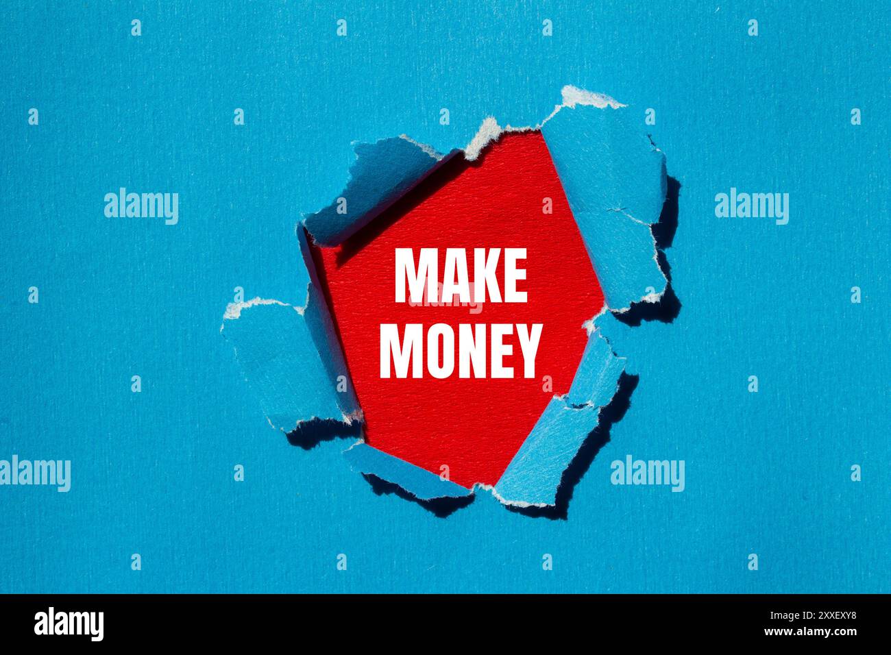 Make money message written on ripped torn blue paper with red ...