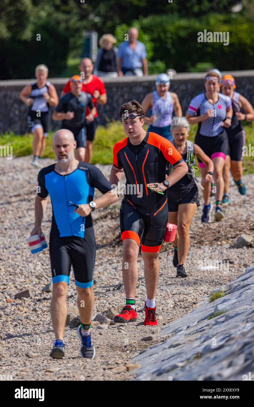 Participants taking part in Clevedons swim run Stock Photo - Alamy