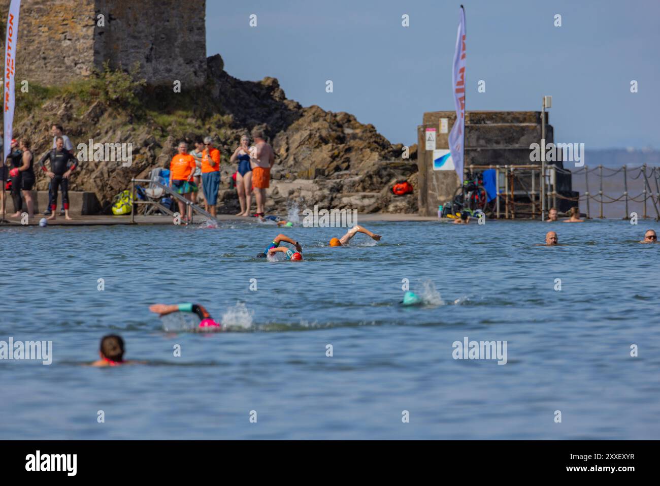 Participants taking part in Clevedons swim run Stock Photo - Alamy