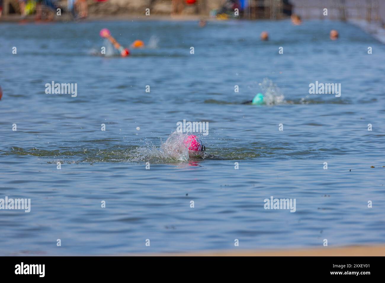 Participants taking part in Clevedons swim run Stock Photo - Alamy
