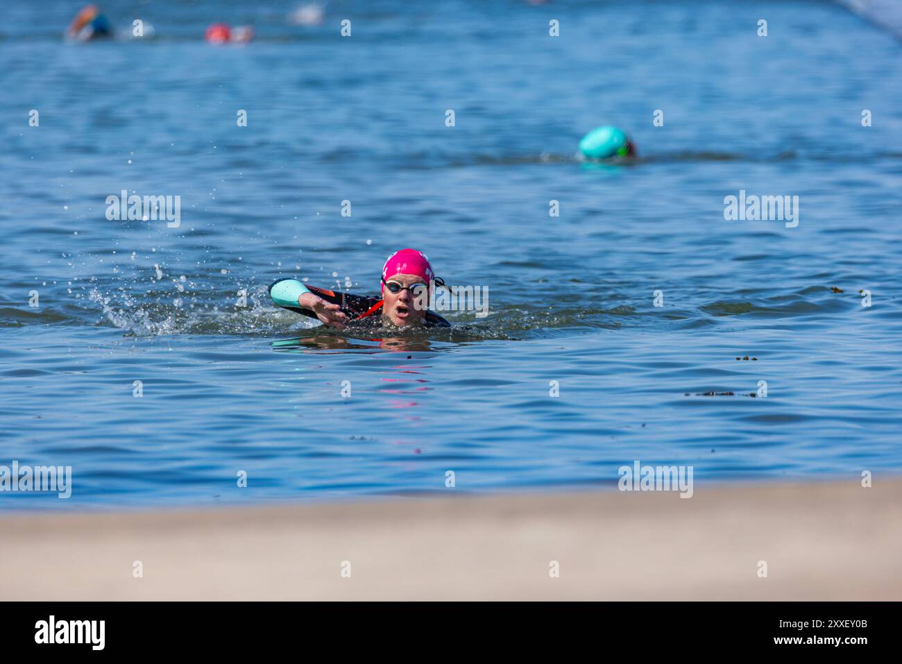 Participants taking part in Clevedons swim run Stock Photo - Alamy