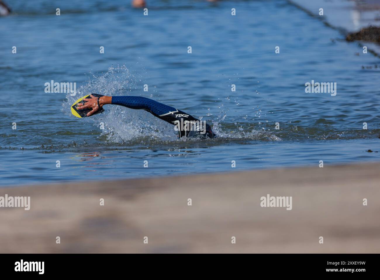 Participants taking part in Clevedons swim run Stock Photo - Alamy