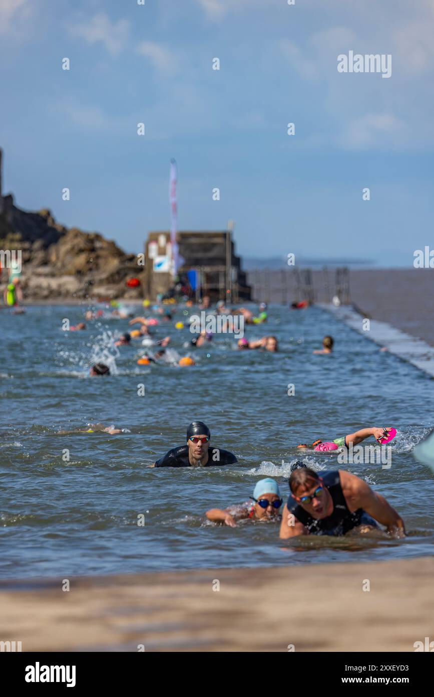 Participants taking part in Clevedons swim run Stock Photo - Alamy
