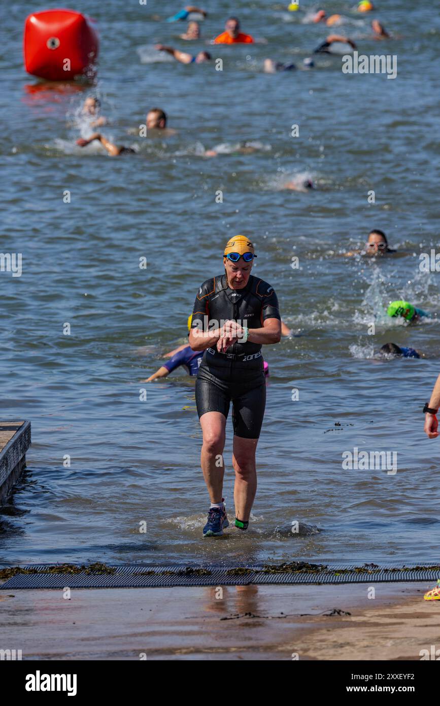 Participants taking part in Clevedons swim run Stock Photo - Alamy