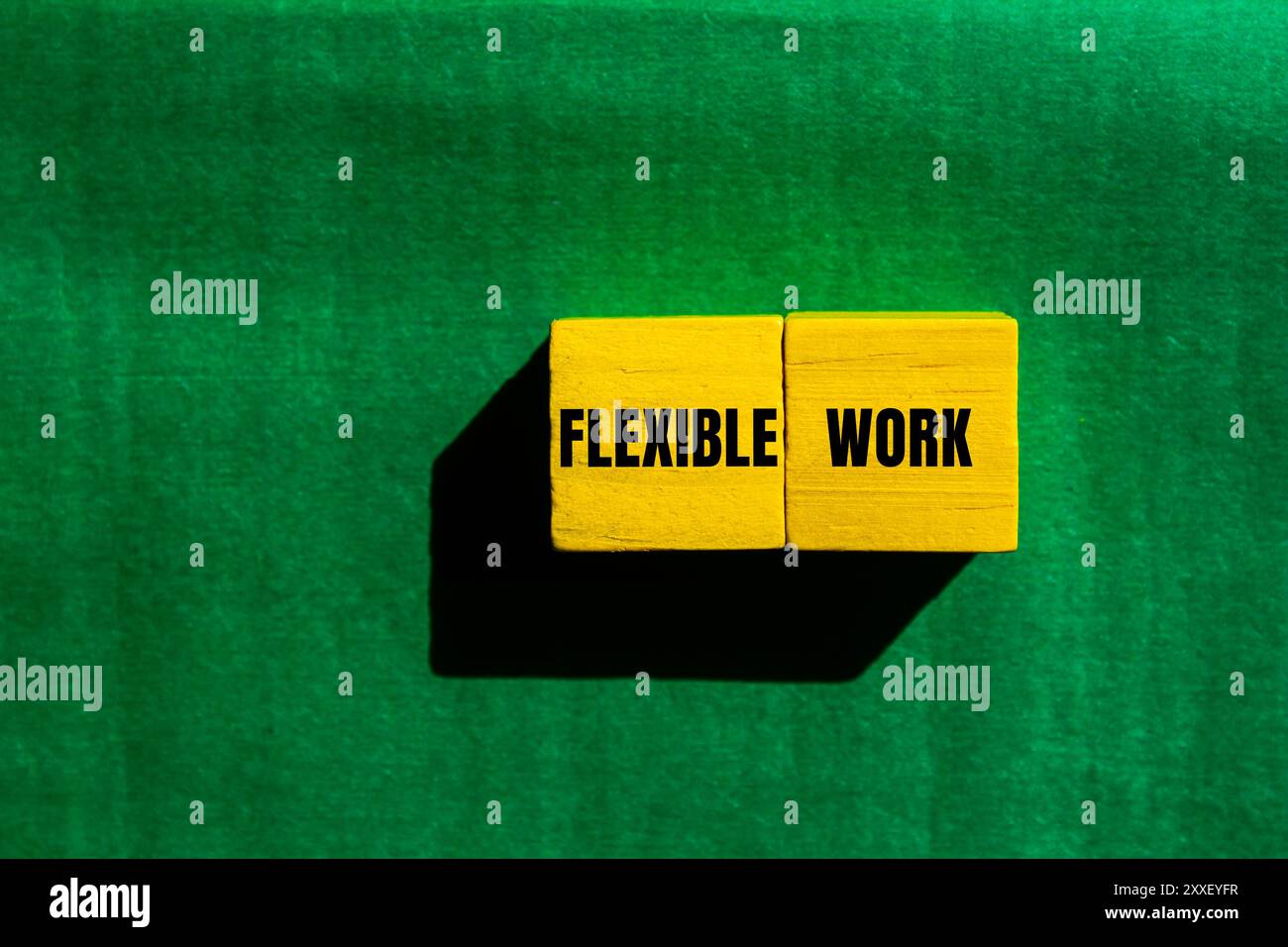 Flexible work message written on yellow wooden cubes with green ...