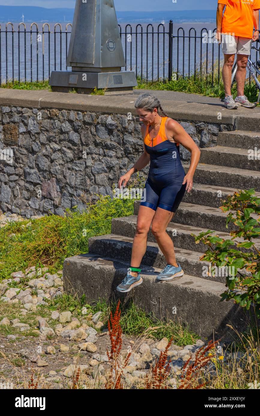 Participants taking part in Clevedons swim run Stock Photo - Alamy