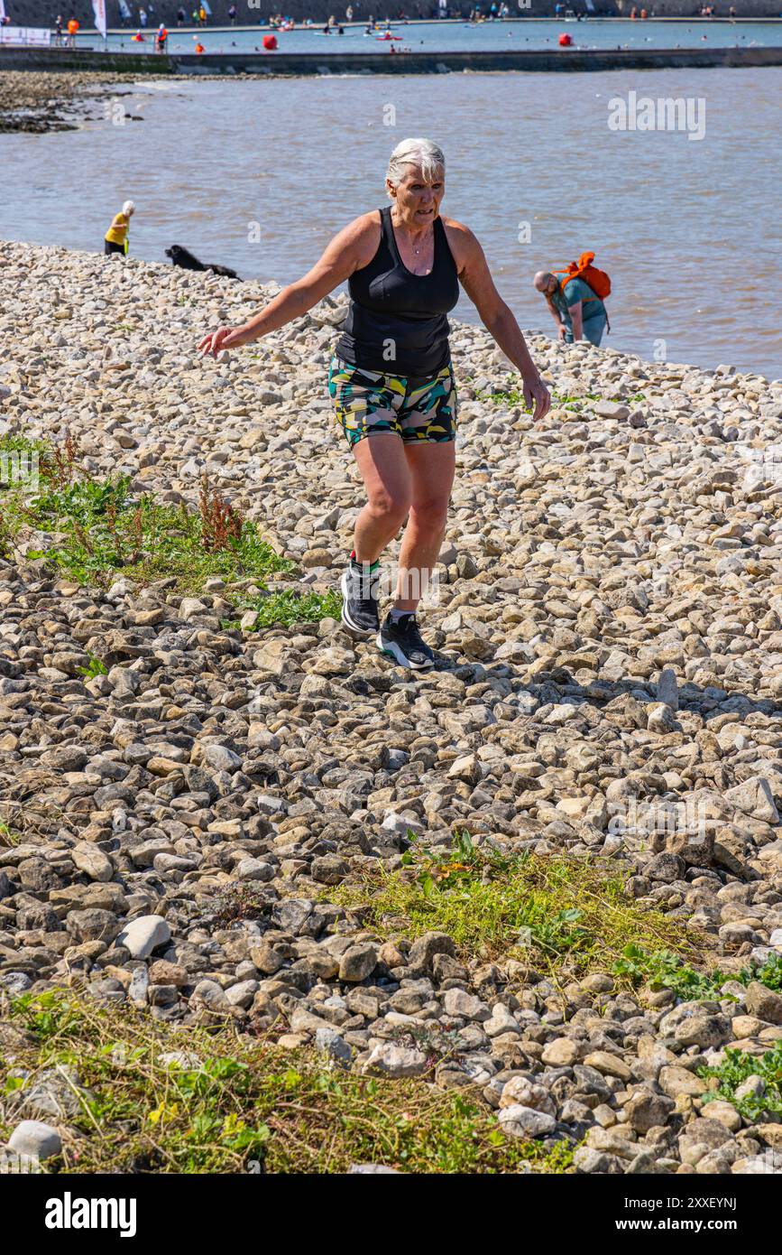 Participants taking part in Clevedons swim run Stock Photo - Alamy