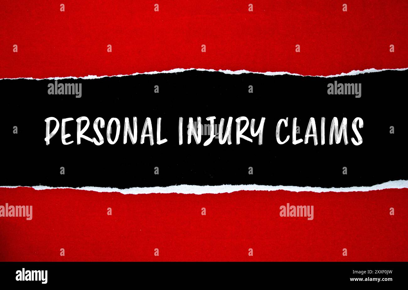 Personal injury claims message written on ripped torn red paper with ...