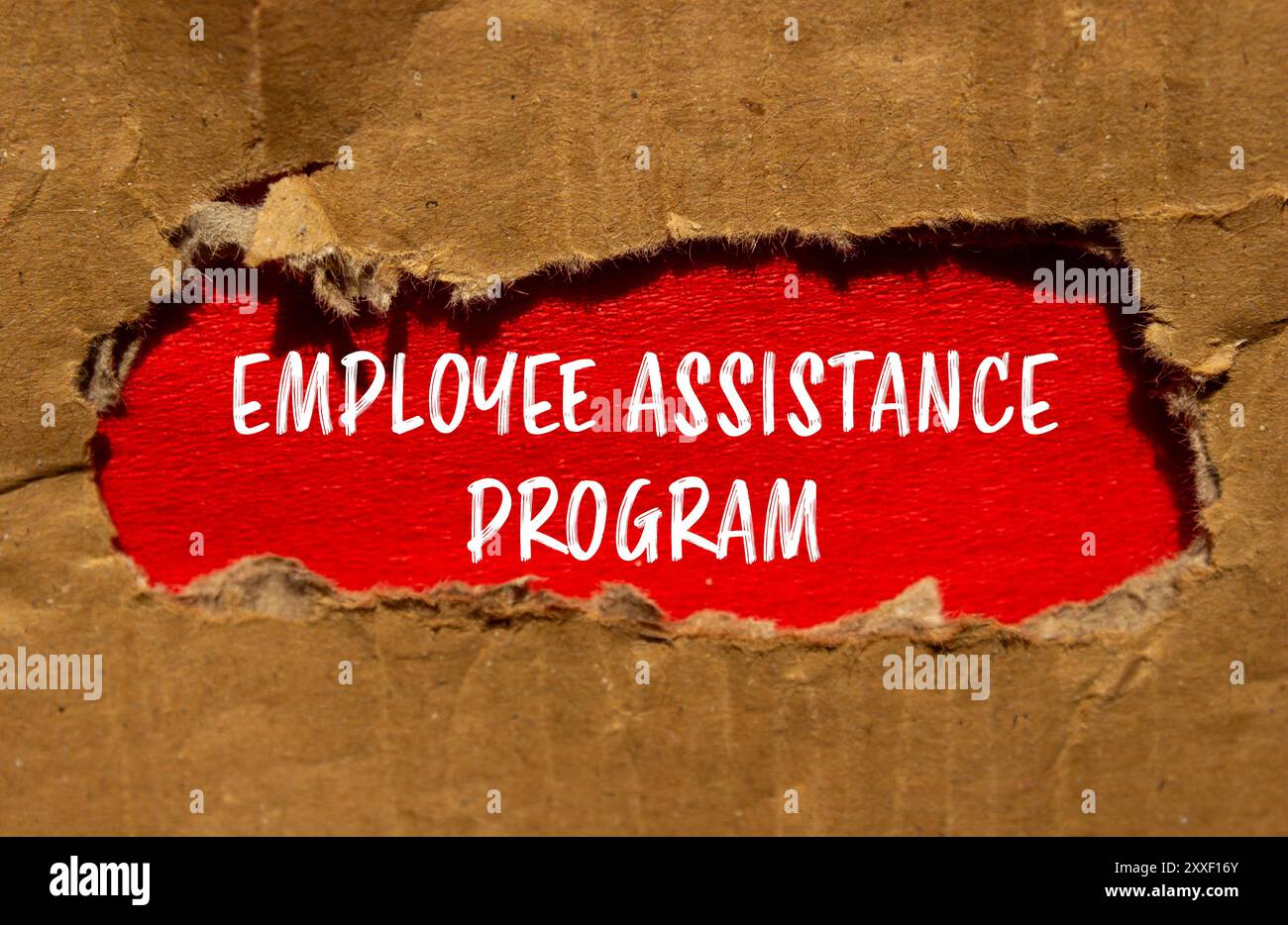 Employee assistance program message written on torn cardboard paper ...
