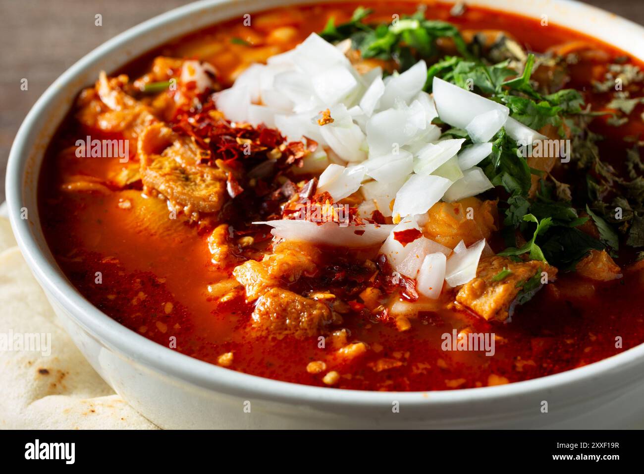 A closeup view of a bowl of menudo Stock Photo - Alamy