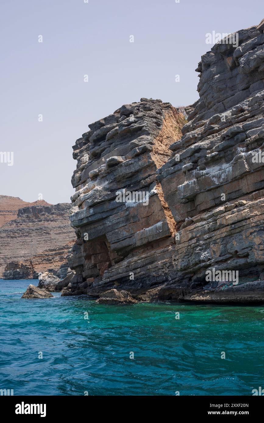 Natural cliffs covered in bird droppings in the remote fjord-like area ...