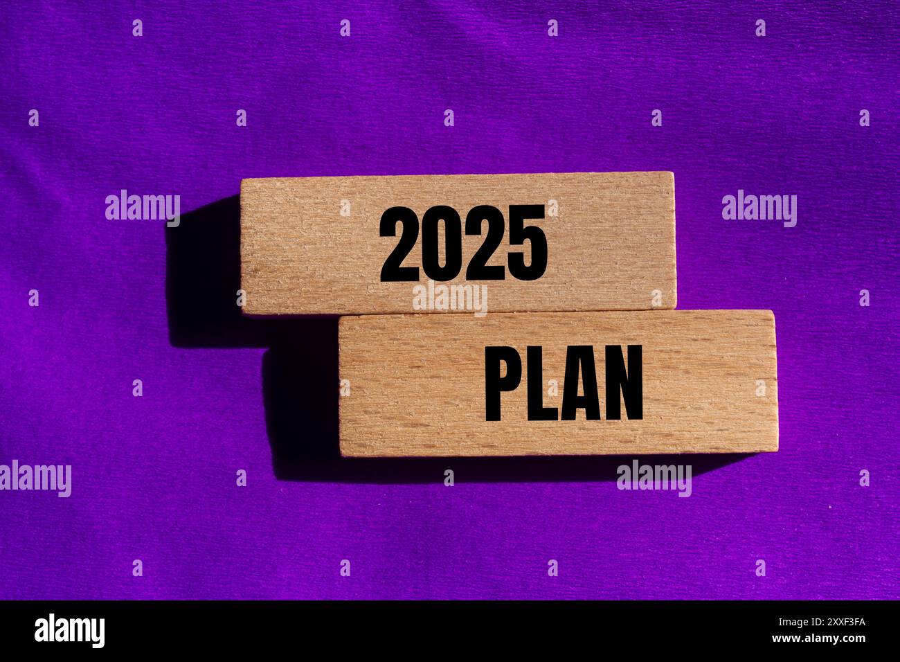 2025 plan message written on wooden blocks with purple background ...