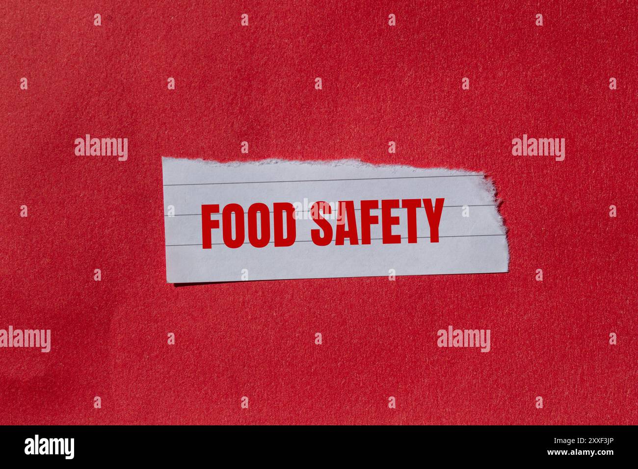 Food safety message written on ripped torn paper piece with red ...