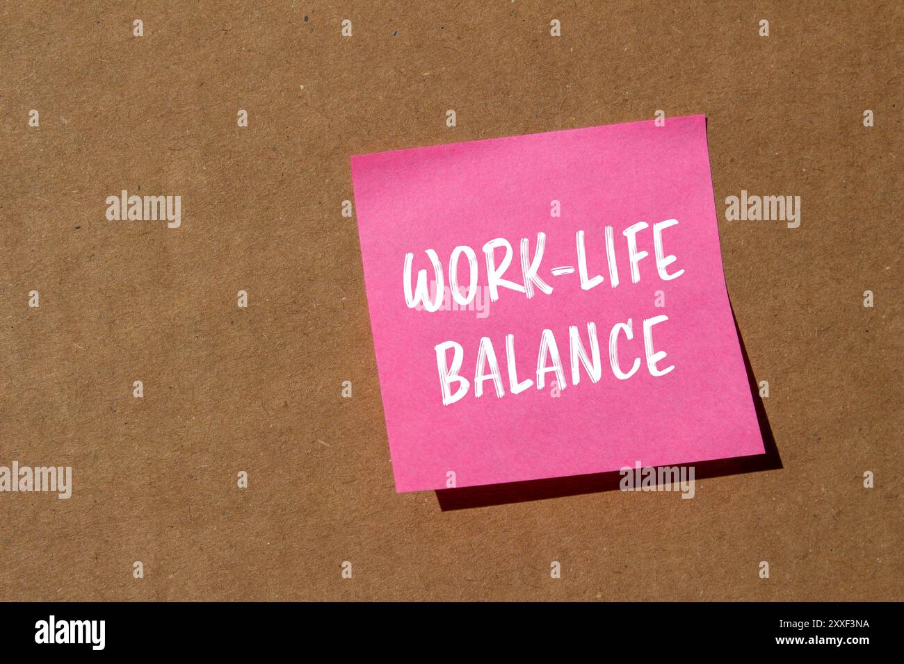 Work life balance message written on pink paper with cardboard ...