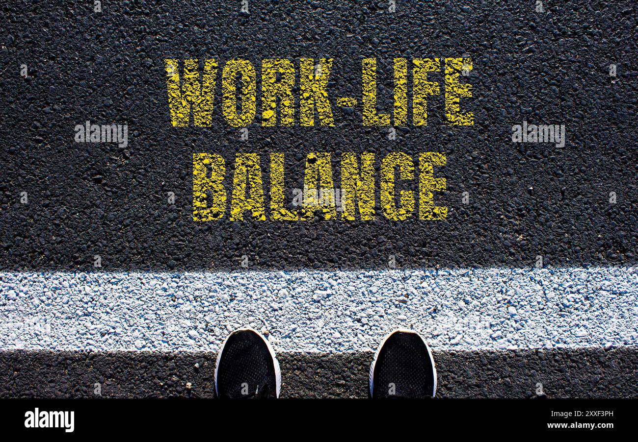 Work life balance message written on asphalt road. Conceptual work life ...